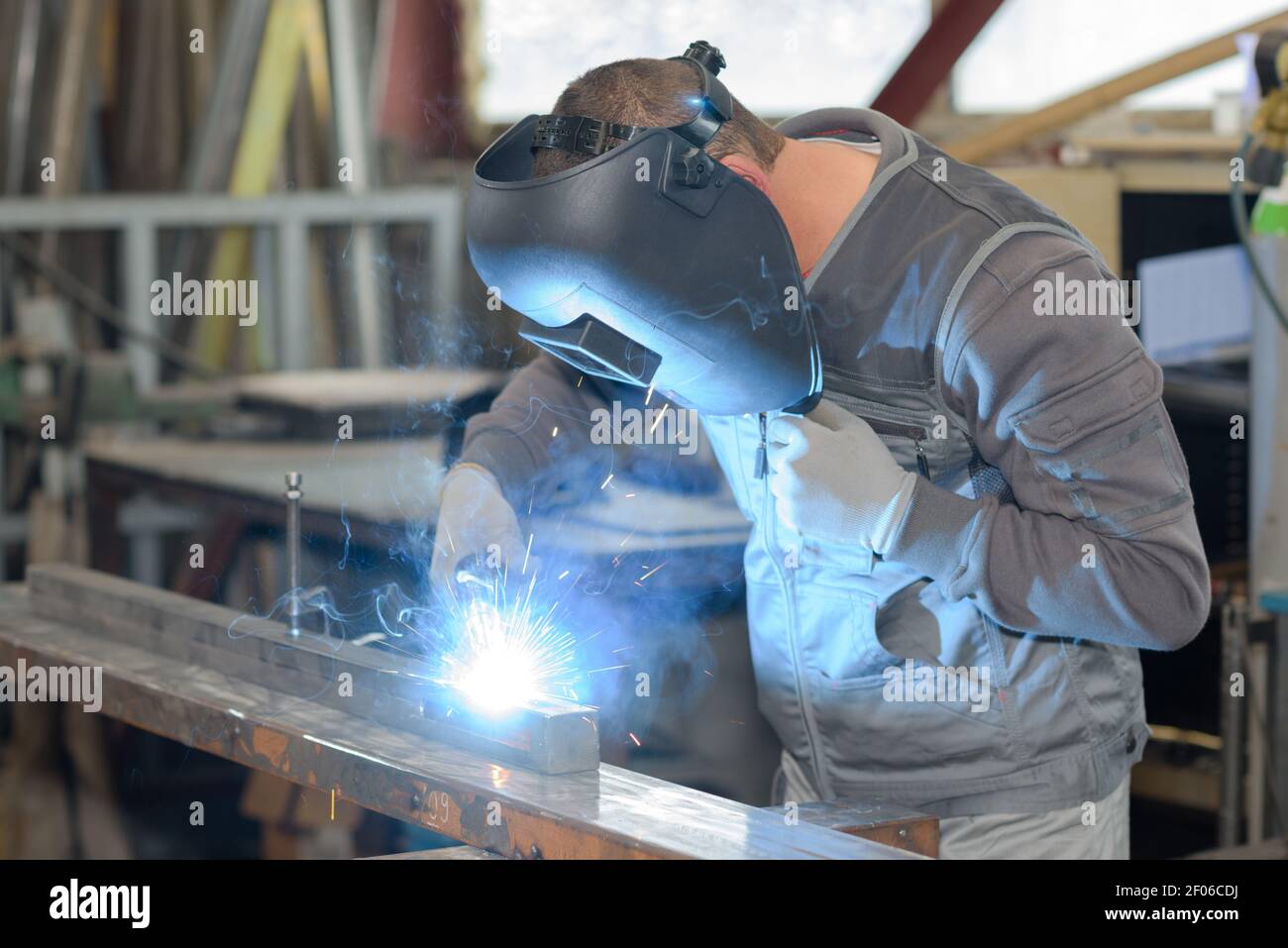 welding man welding pipe in industry Stock Photo - Alamy