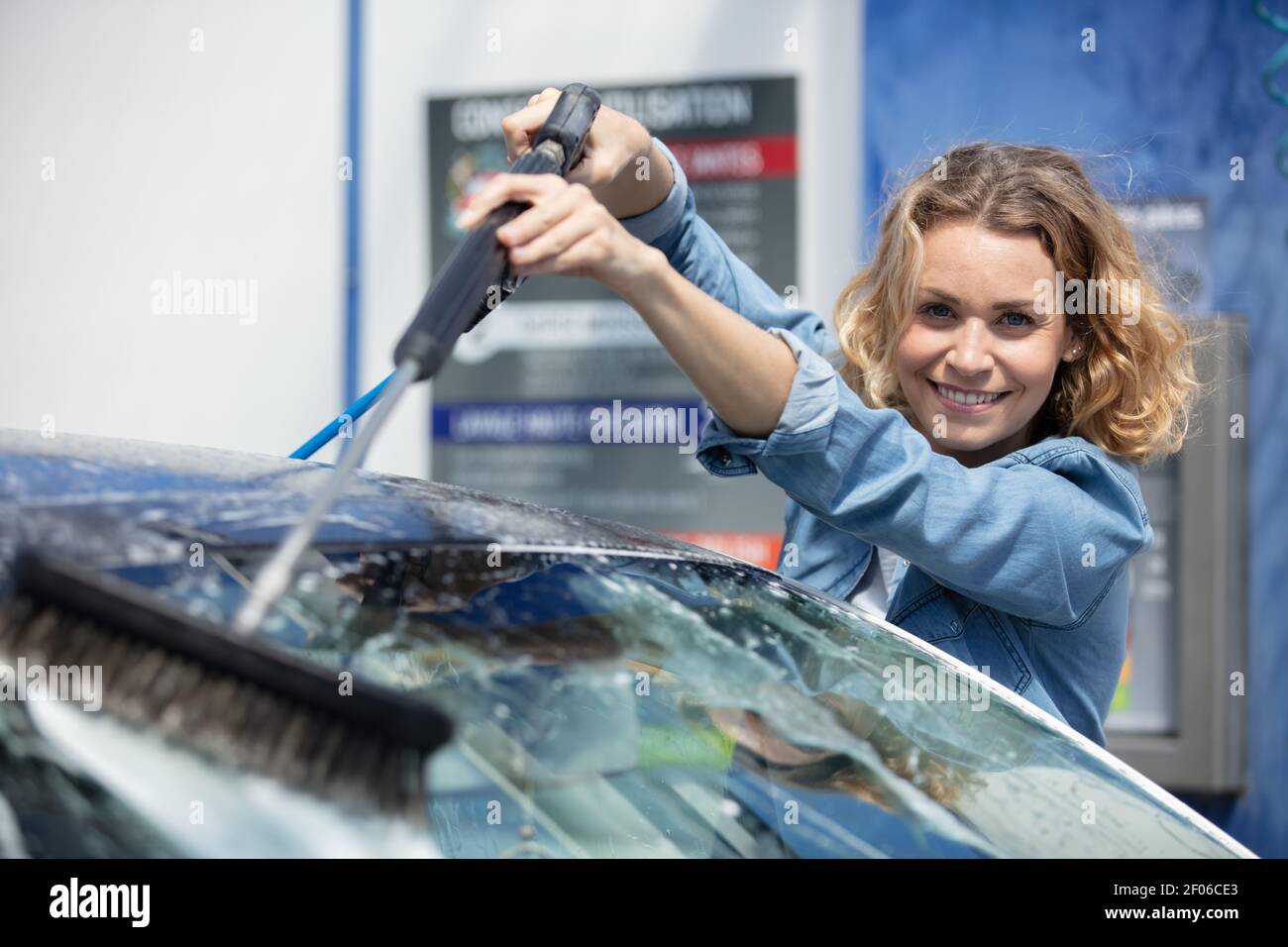 happy girl cleaning her car Stock Photo - Alamy