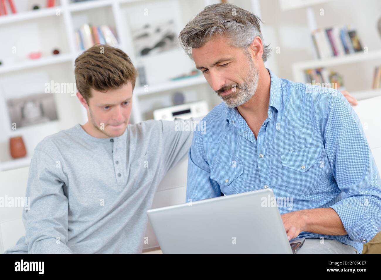father and son with technology Stock Photo - Alamy