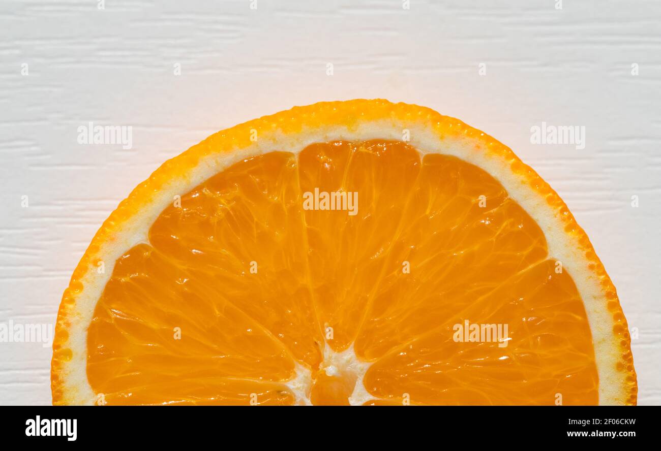 Part of an orange slice on a white background. Place for your text ...
