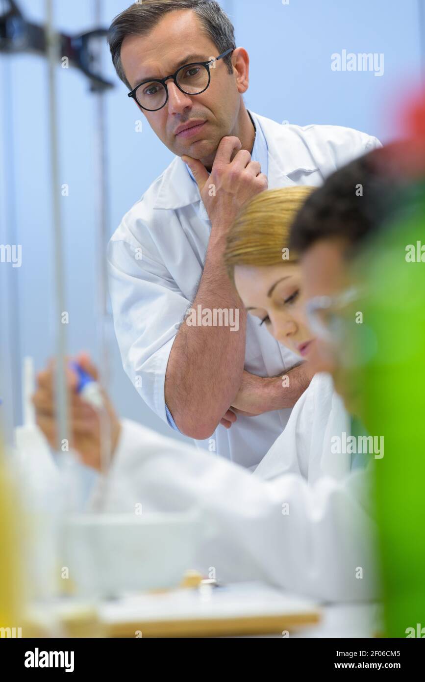 teacher with group of students in the lab Stock Photo - Alamy