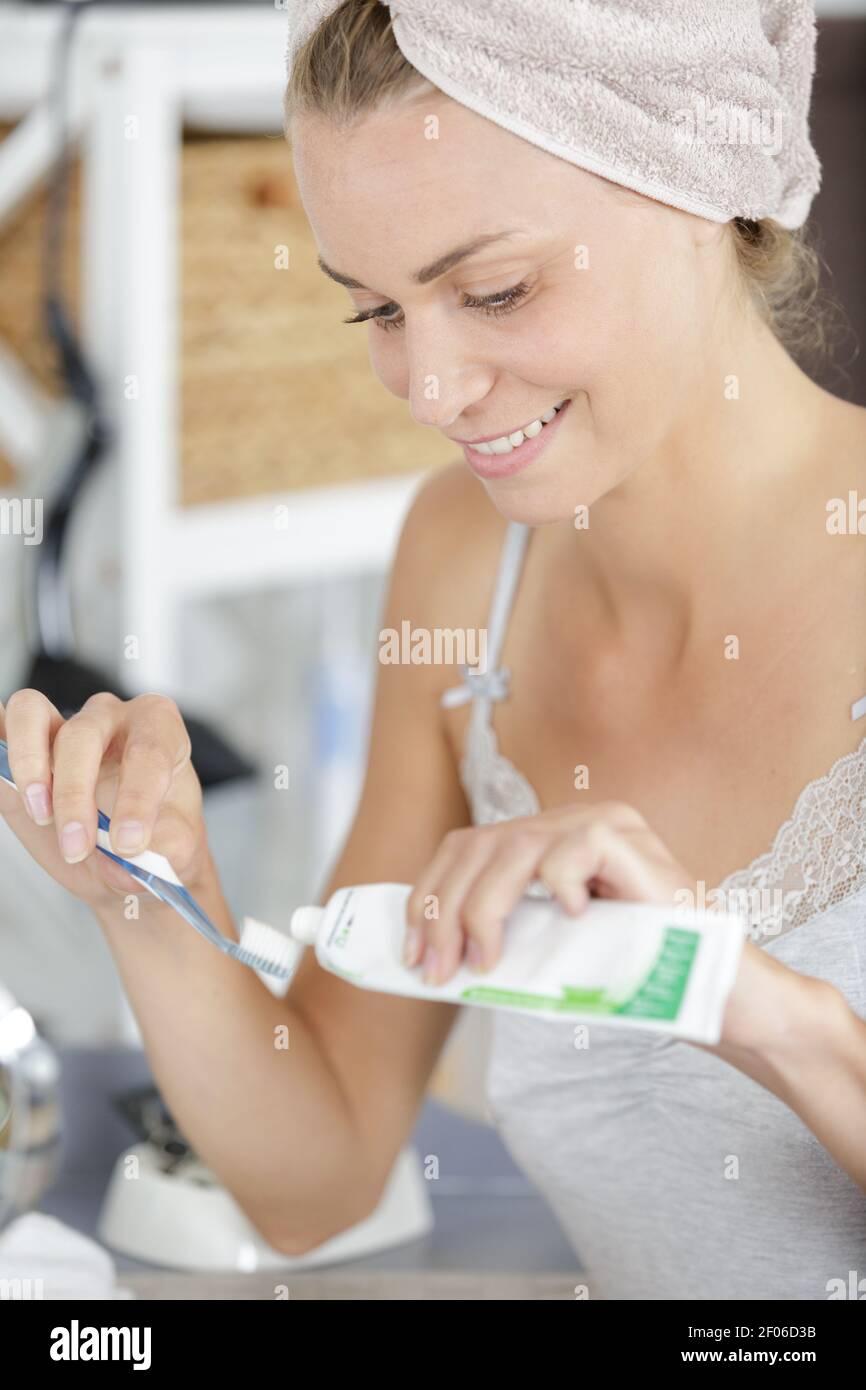 portrait of beautiful young woman brushing teeth Stock Photo - Alamy