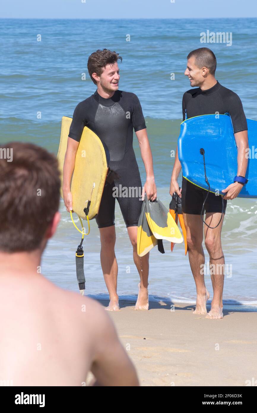 men boardboarders at the beach Stock Photo - Alamy
