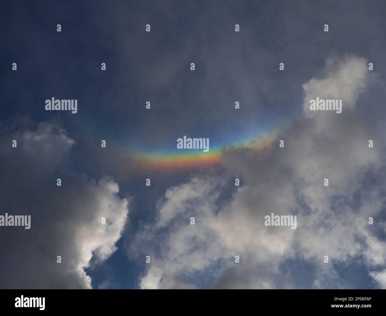 Panorama cloudscape view of natural colorful rainbow with white clouds ...