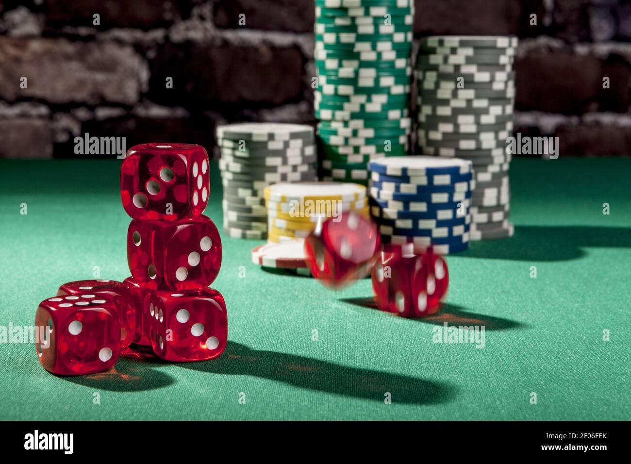 Rolling Red Dice Stock Photo - Alamy