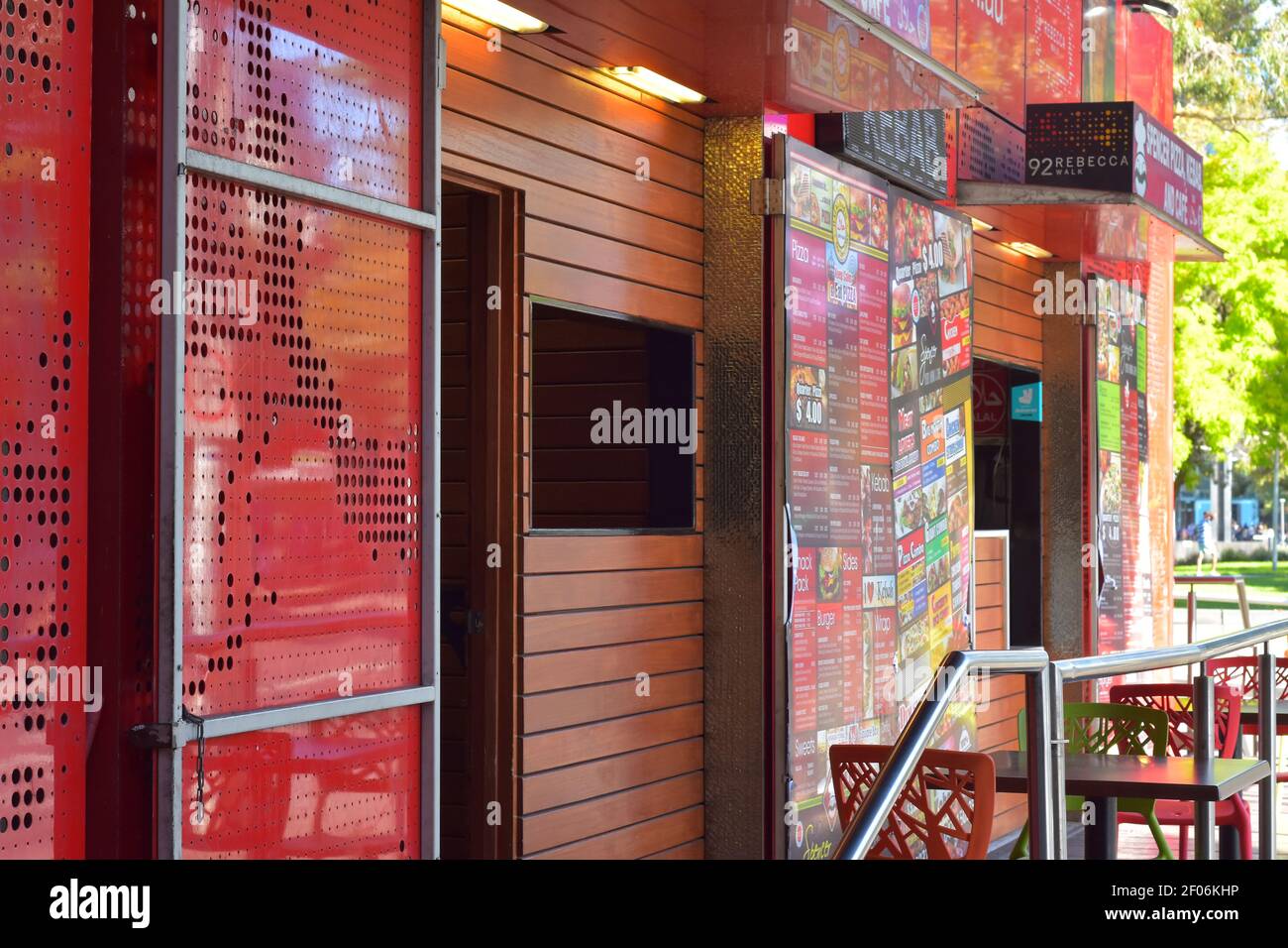 Tiny kebab shop with slate store front and menu board with empty store ...