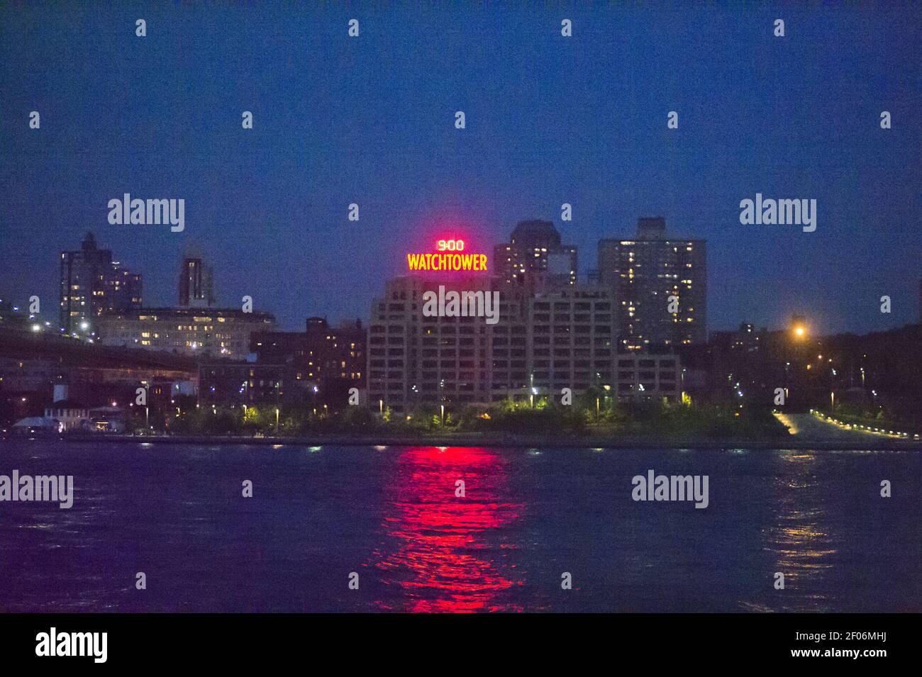 A Jehovah's Witnesses building with a neon sign saying Watchtower ...