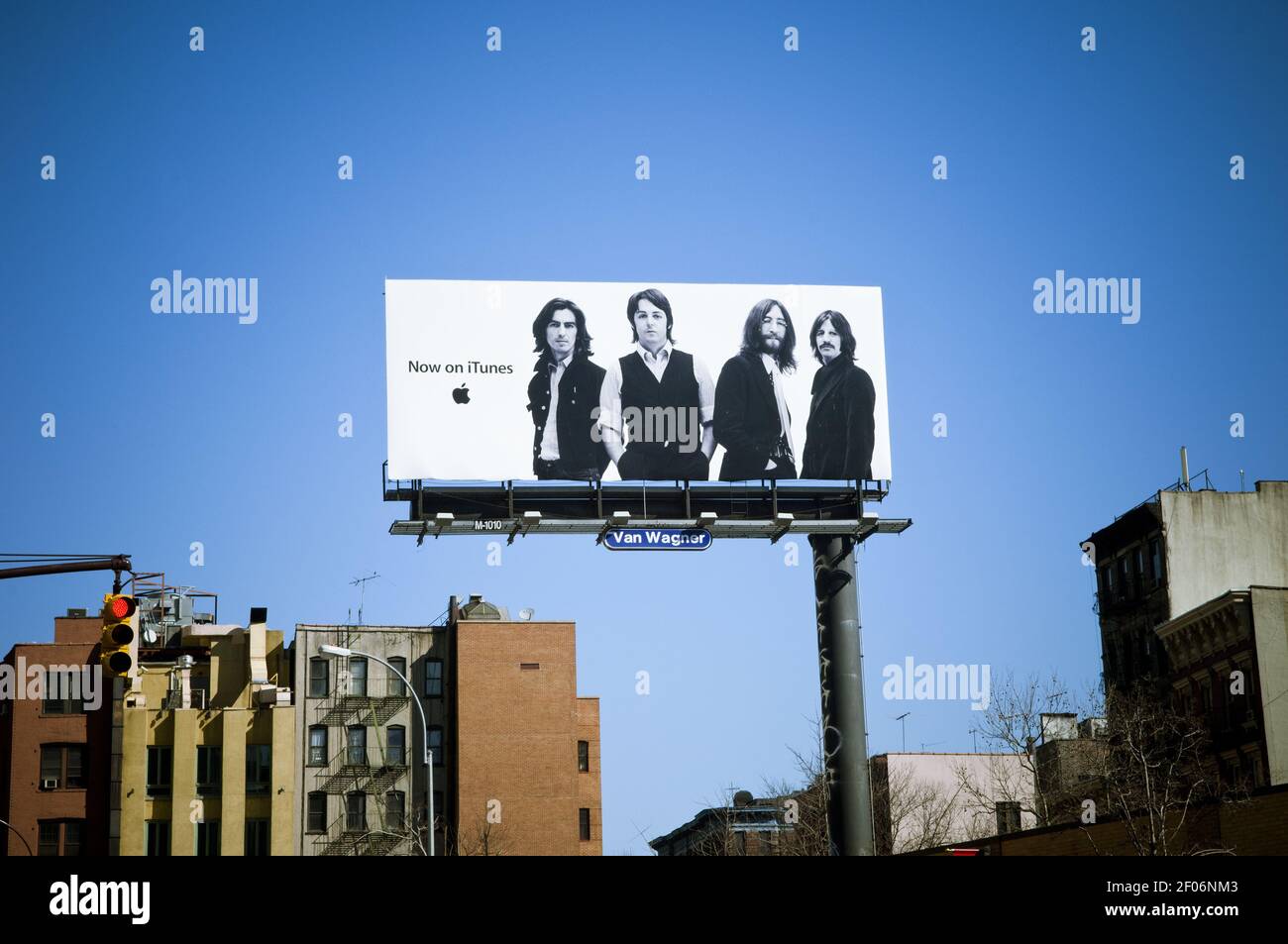 A billboard for the Apple iTunes music store features an archival photo ...