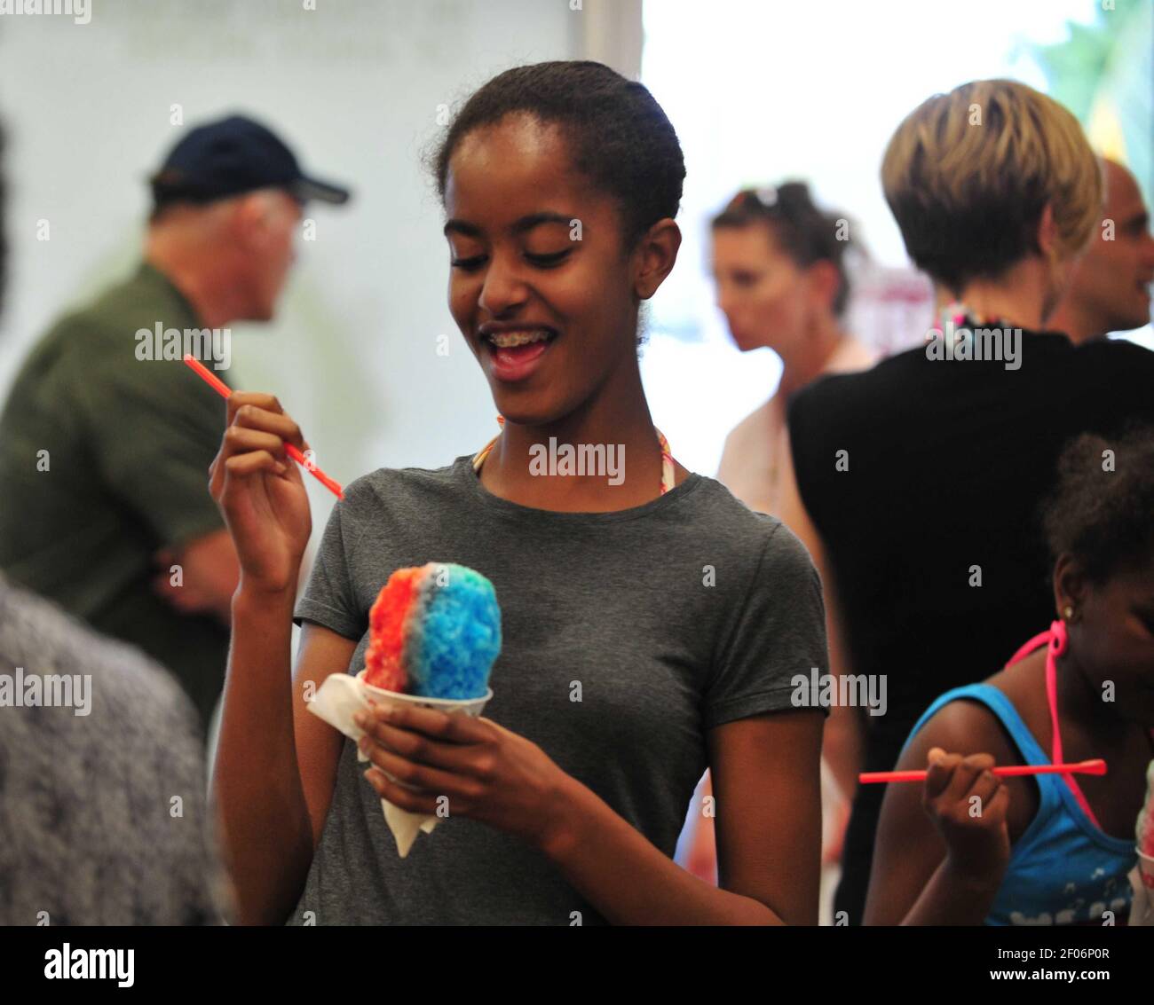 3 January 2011 - Kailua, Hawaii - Malia Obama enjoys shave ice with her ...