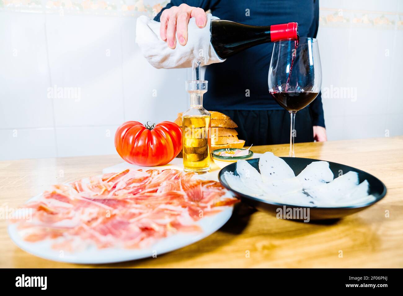 Typical spanish or catalan food on wooden background. Iberian ham, goat ...