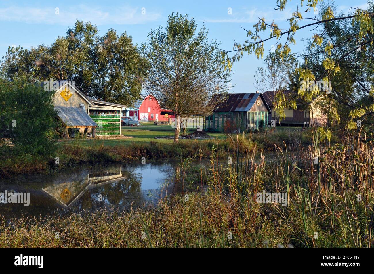 Buildings reflected in a pond at Red Oak II, a collection of heritage ...