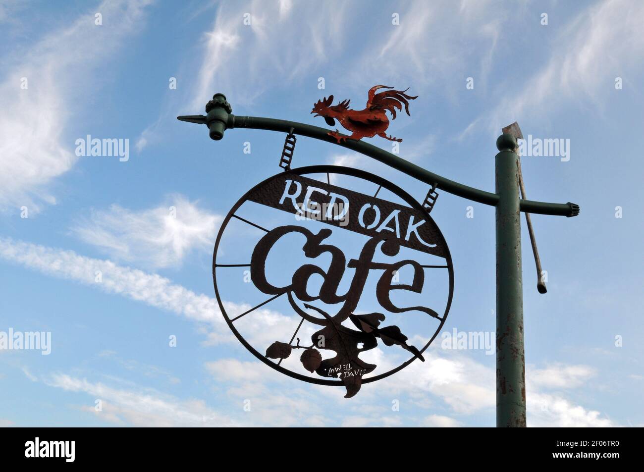 A metal sign for the Red Oak Cafe at Red Oak II, a community and ...