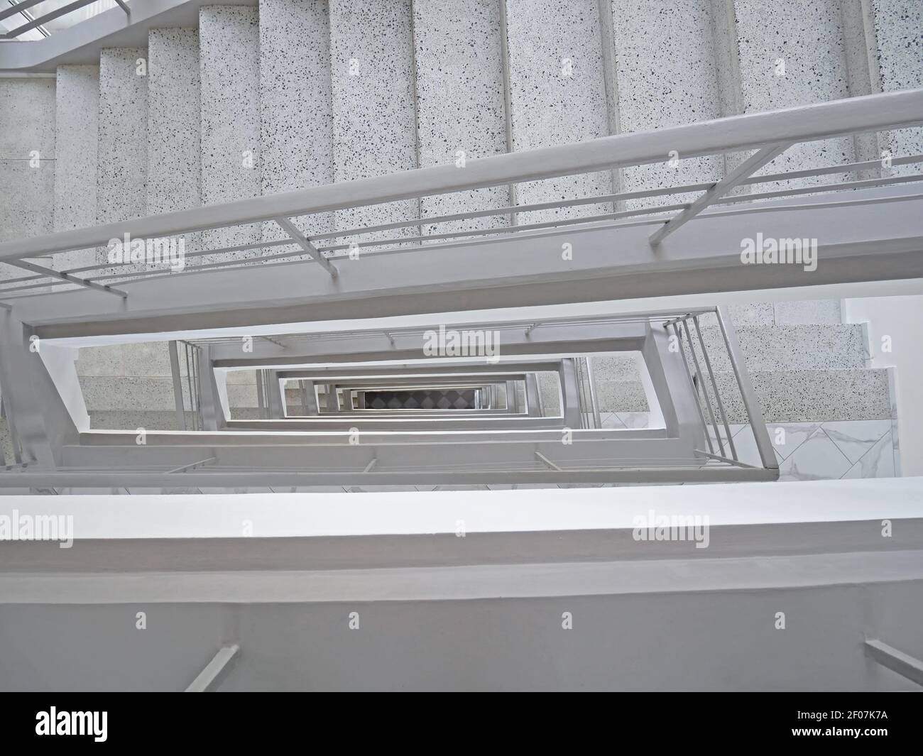 Long high stairwell in shades of gray, concrete steps in spotted ...