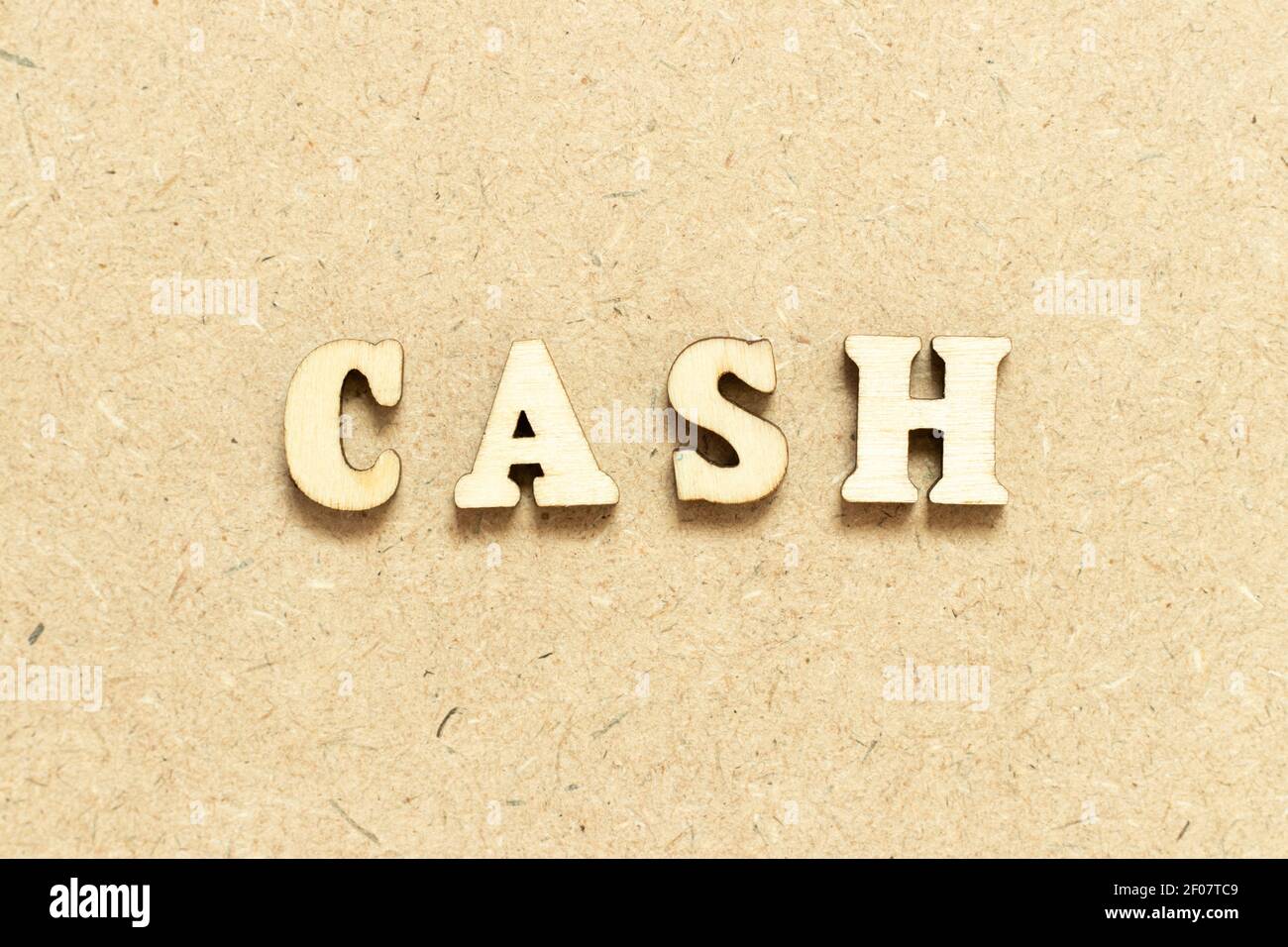 Alphabet letter in word cash on wood background Stock Photo - Alamy