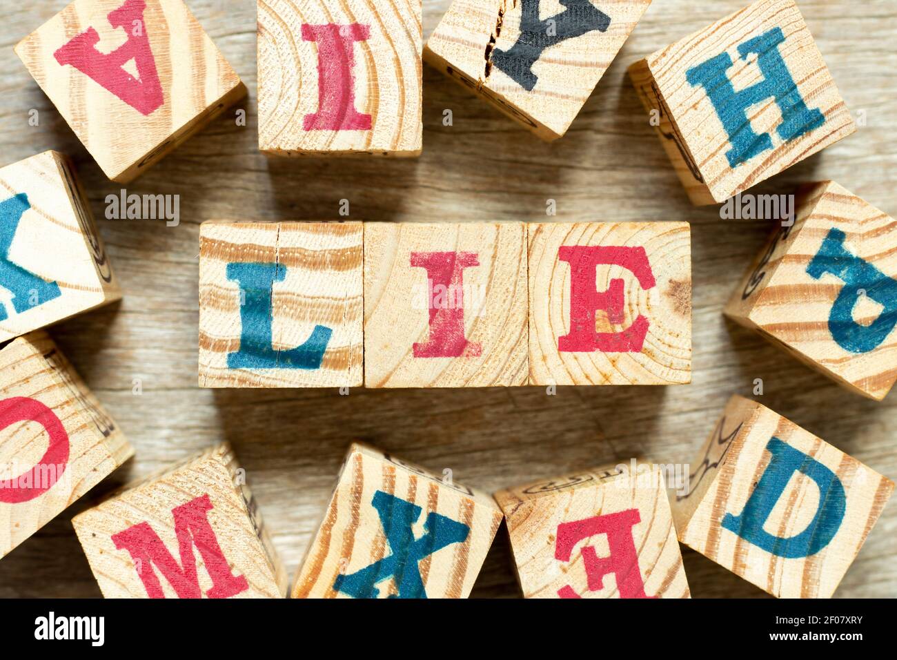 Alphabet letter block in word lie with another on wood background Stock ...