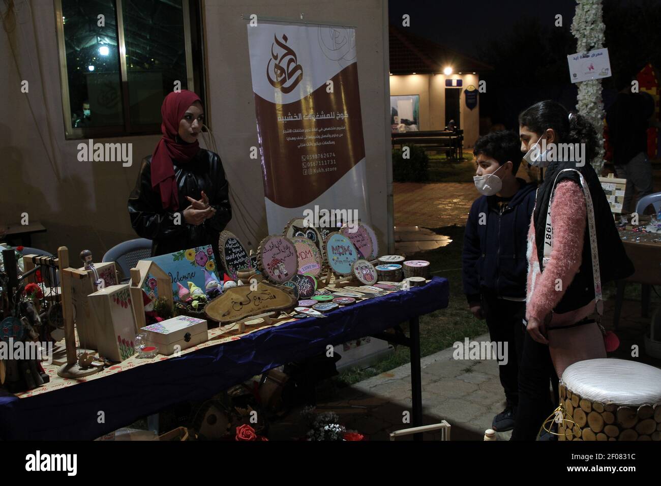 Gaza. 6th Mar, 2021. A Palestinian woman shows her handicrafts to ...
