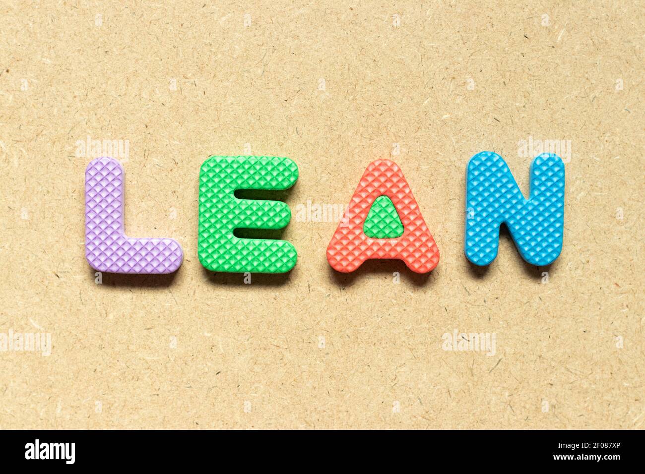 Foam alphabet letter in word lean on wood background Stock Photo - Alamy