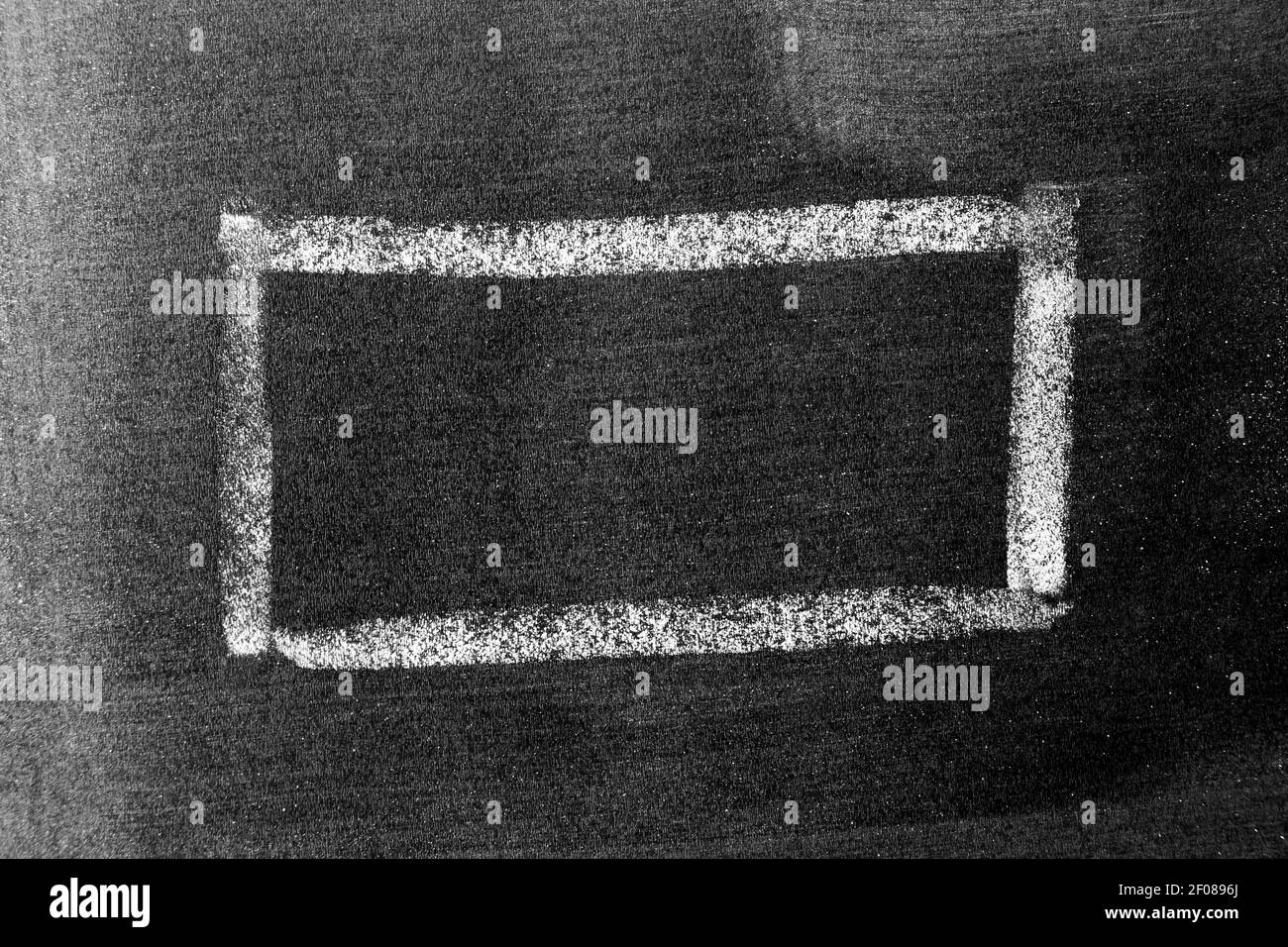 White chalk hand drawing in square or banner shape on black board ...
