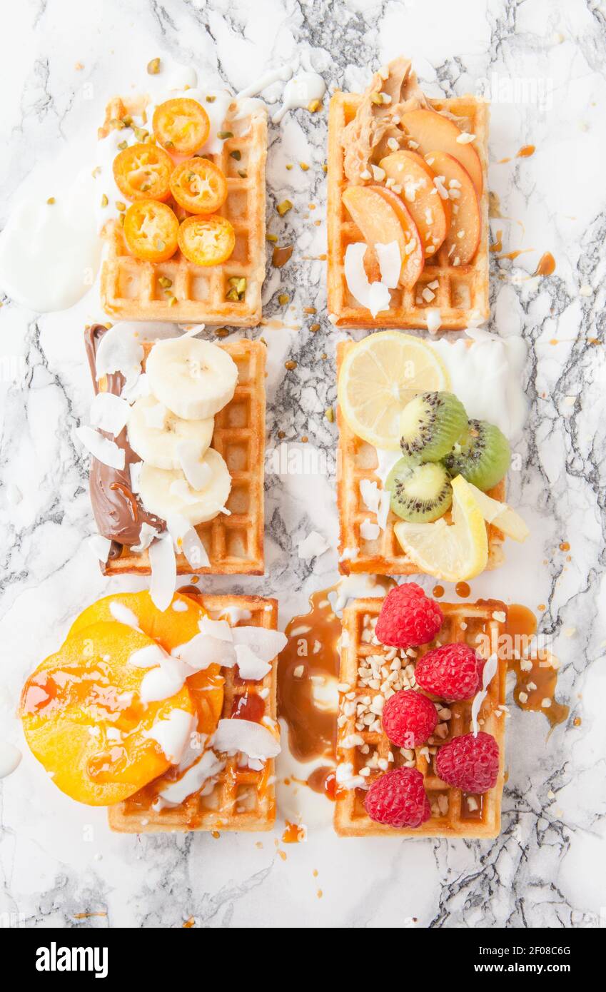 Waffles with coloured fruits Stock Photo - Alamy