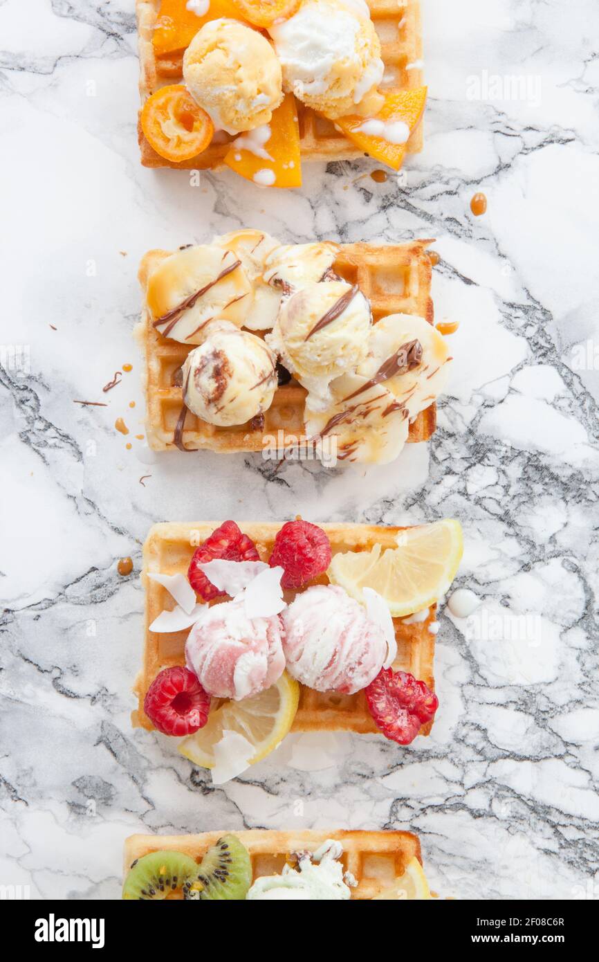 Waffles with coloured fruits Stock Photo - Alamy