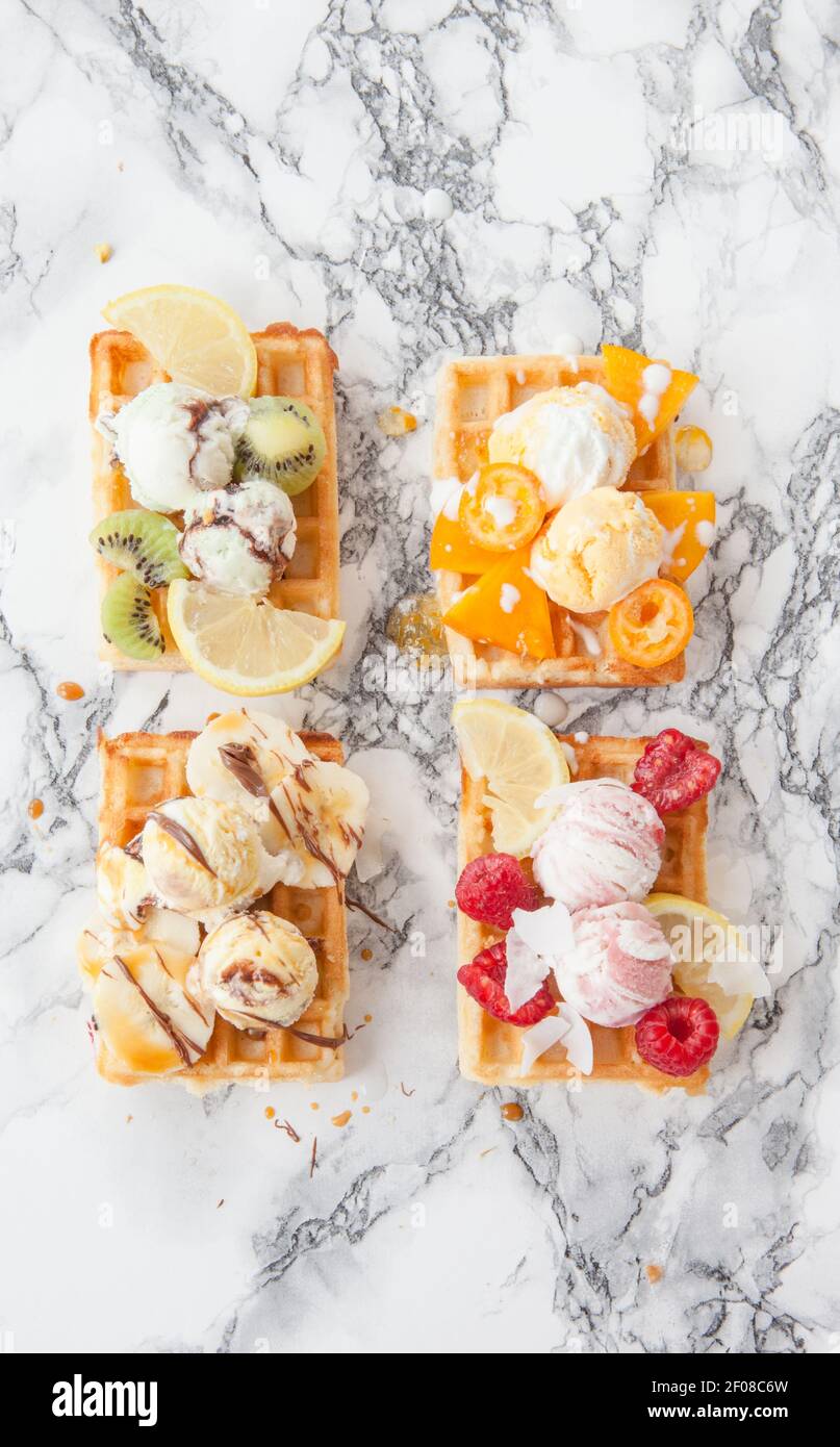 Waffles with coloured fruits Stock Photo - Alamy