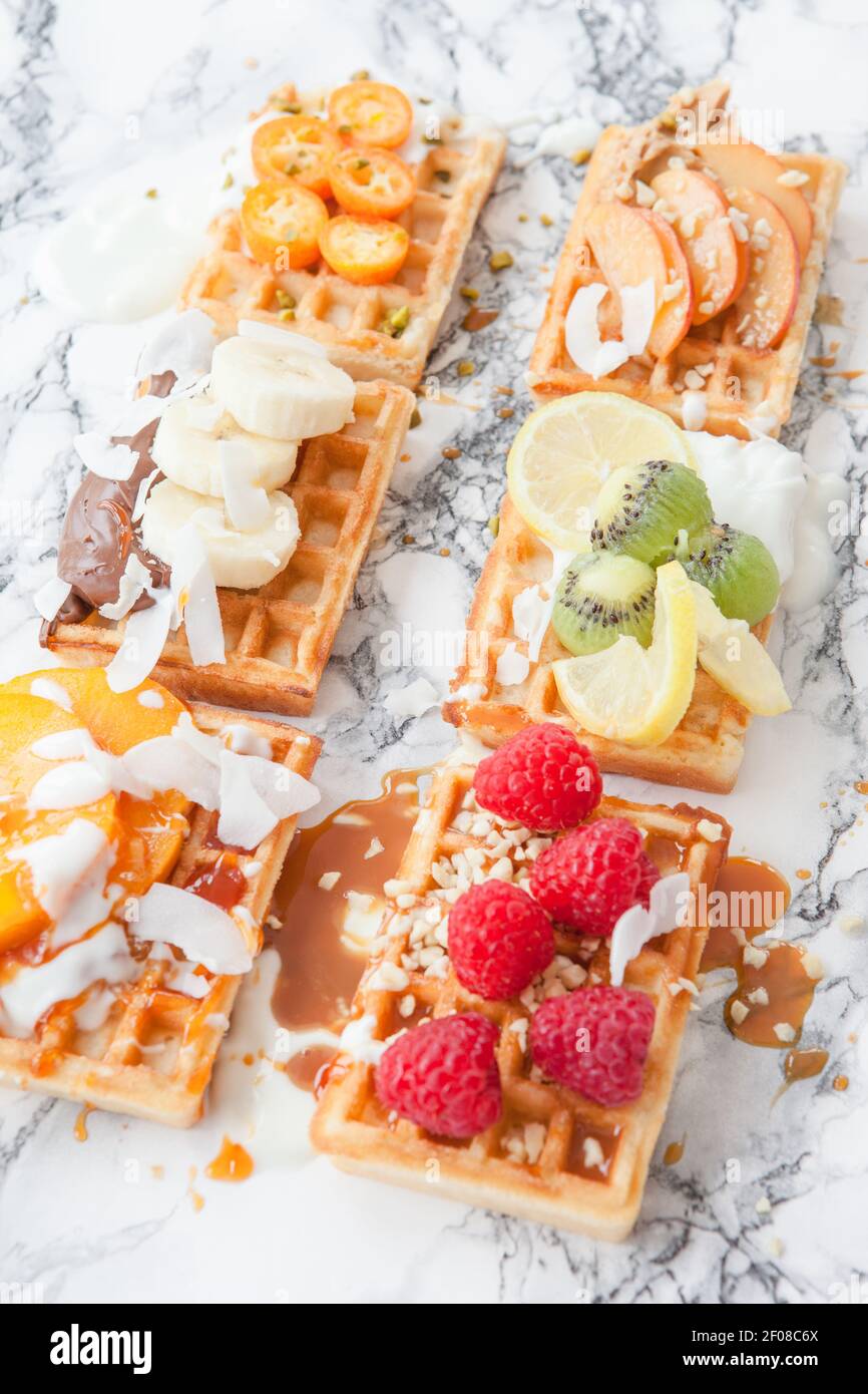 Waffles with coloured fruits Stock Photo - Alamy