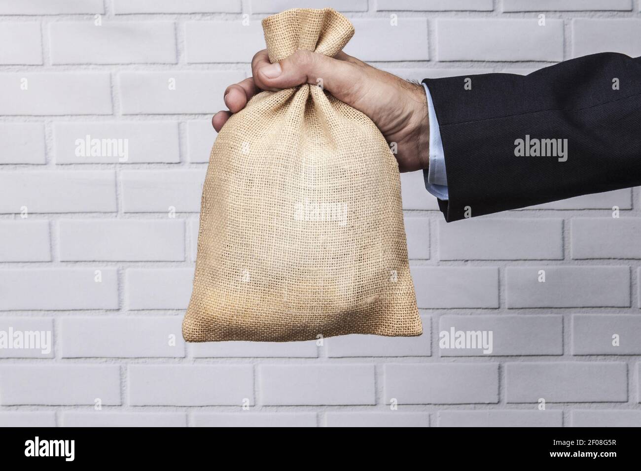 Sack in Hand Stock Photo - Alamy