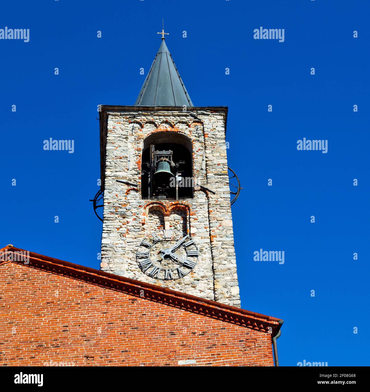 Antique building clock tower in italy europe old stone and bell Stock ...