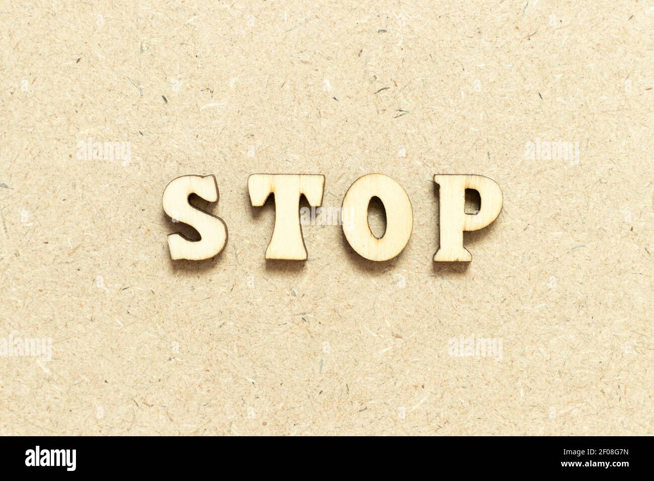 Alphabet letter in word stop on wood background Stock Photo - Alamy