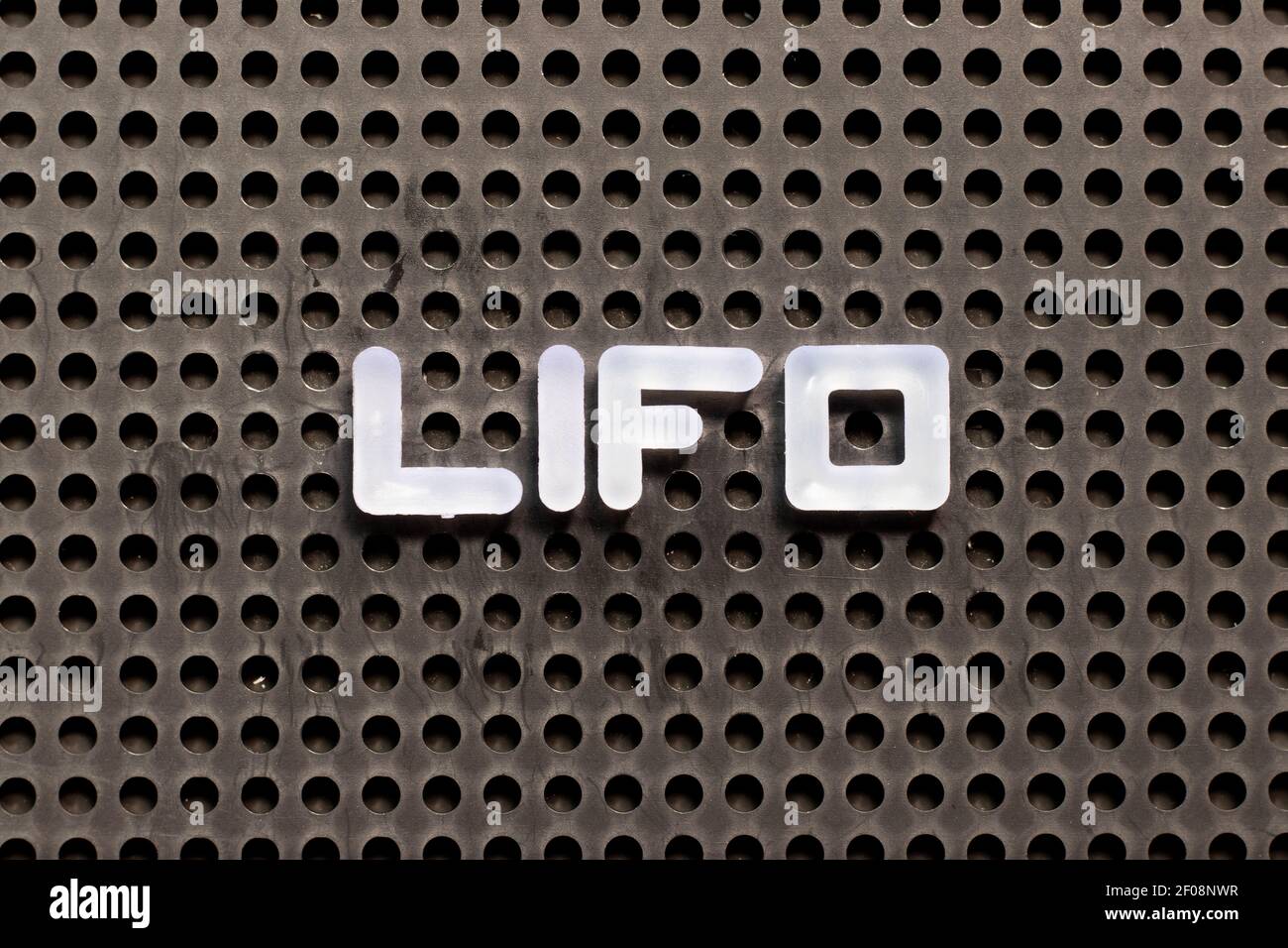 White color letter in word LIFO (abbreviation of last in first out) on ...