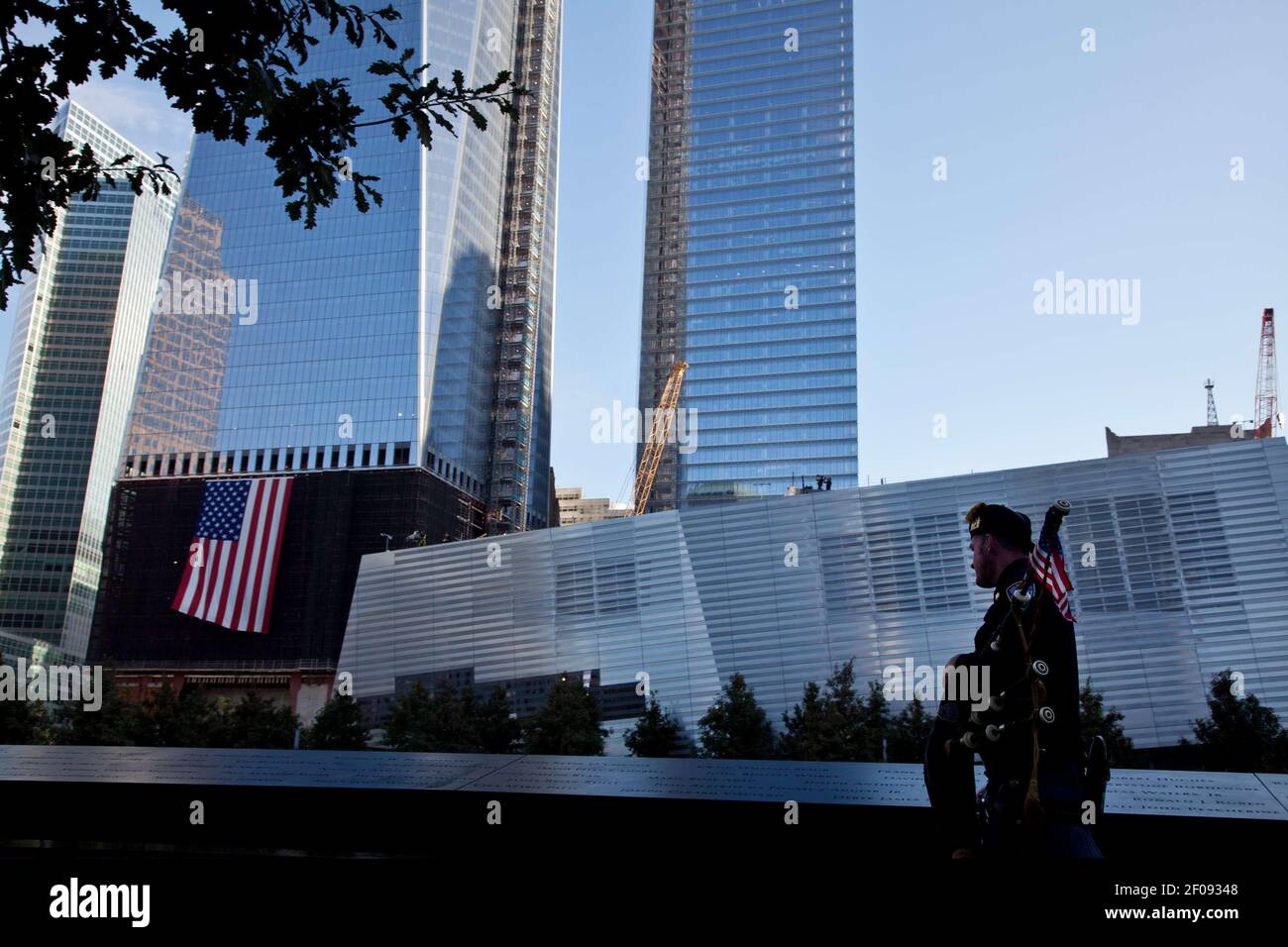 11 September 2011 - New York, NY - A bagpiper walks past the 9/11 ...