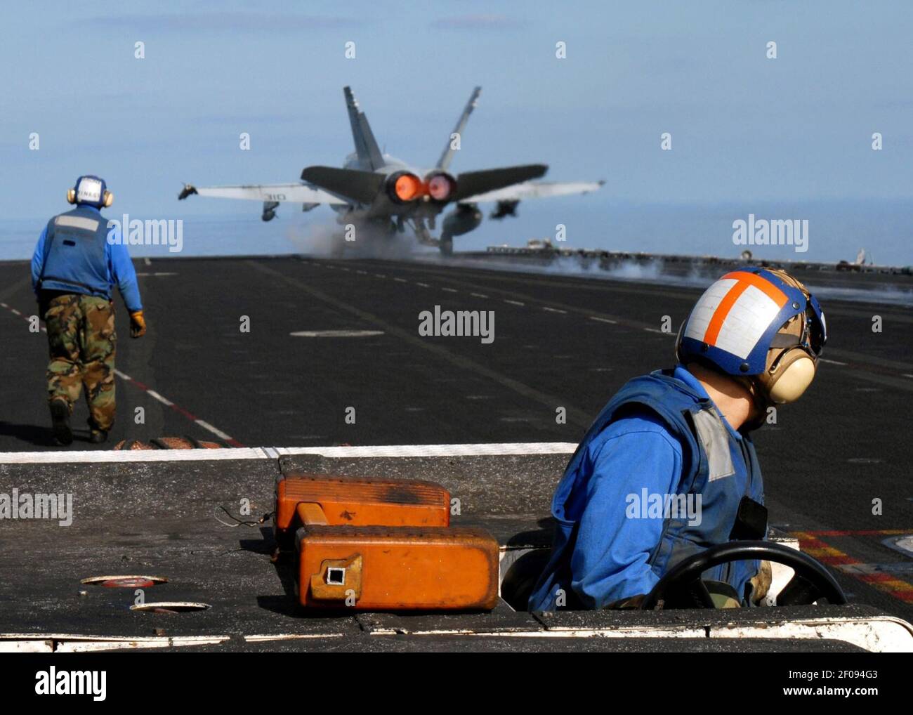 Plane handler manning aircraft tug on USS Theodore Roosevelt (CVN-71 ...
