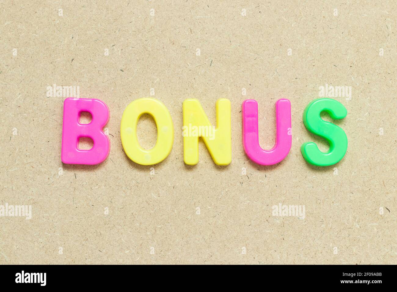 Color alphabet letter with word bonus on wood background Stock Photo ...