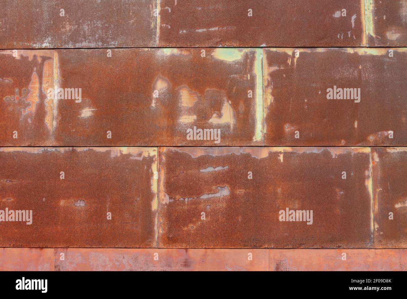 Rusty steel plating made by Nisshin (Nippon) Steel on the wall of a ...