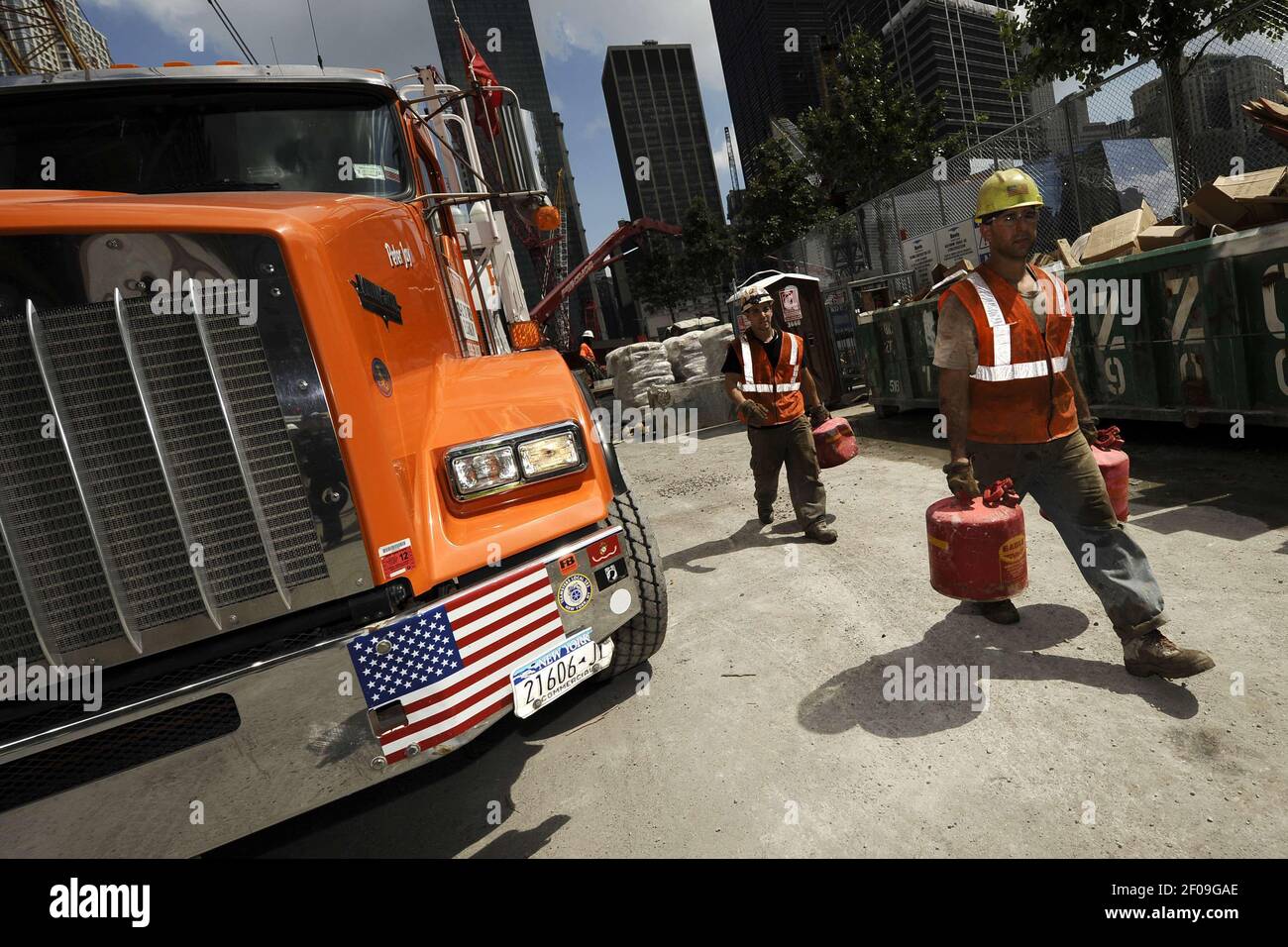 04 August 2011 - New York - Construction workers move materialsl as ...