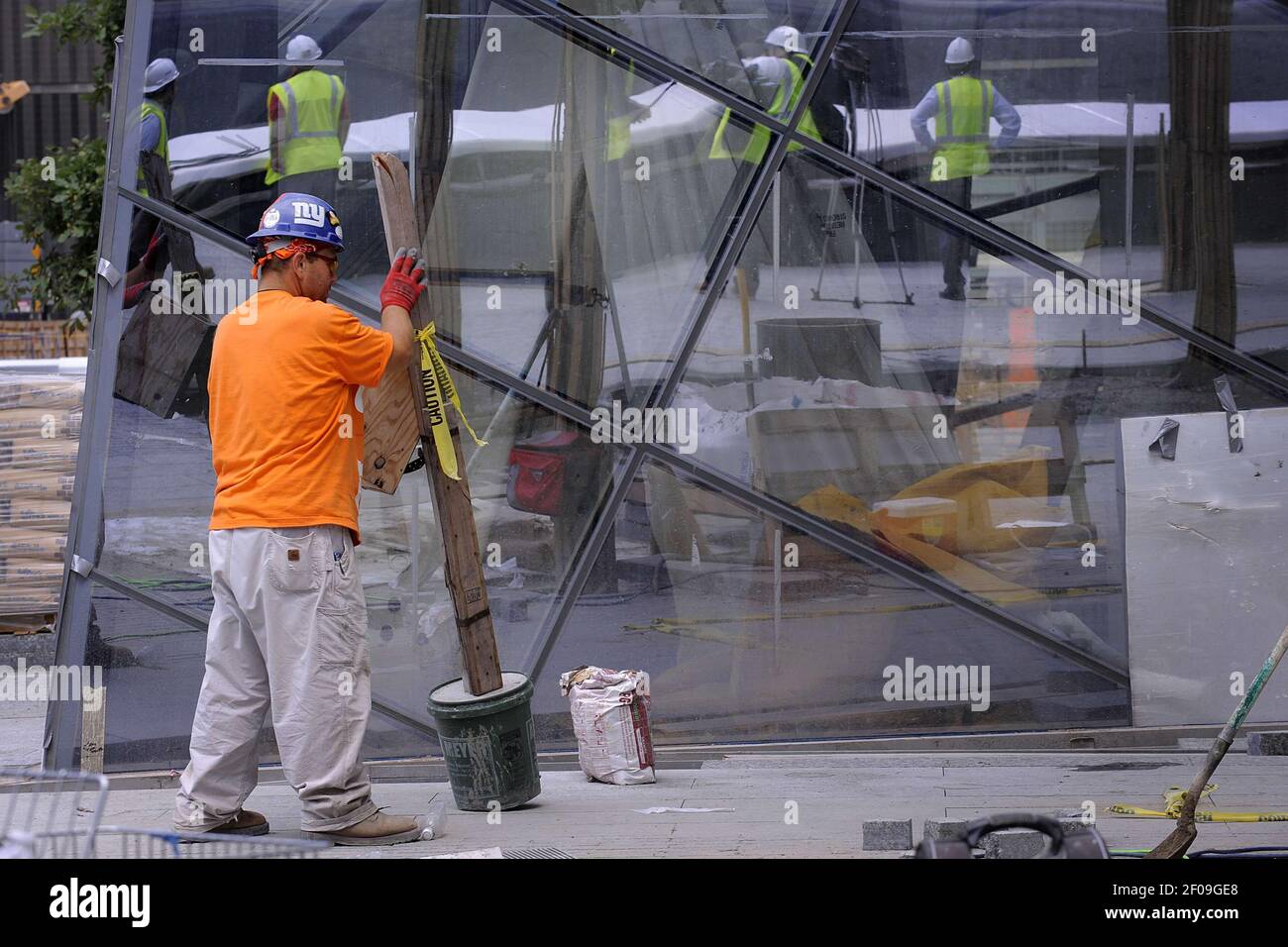 04 August 2011 - New York - Construction workers move materialsl as ...
