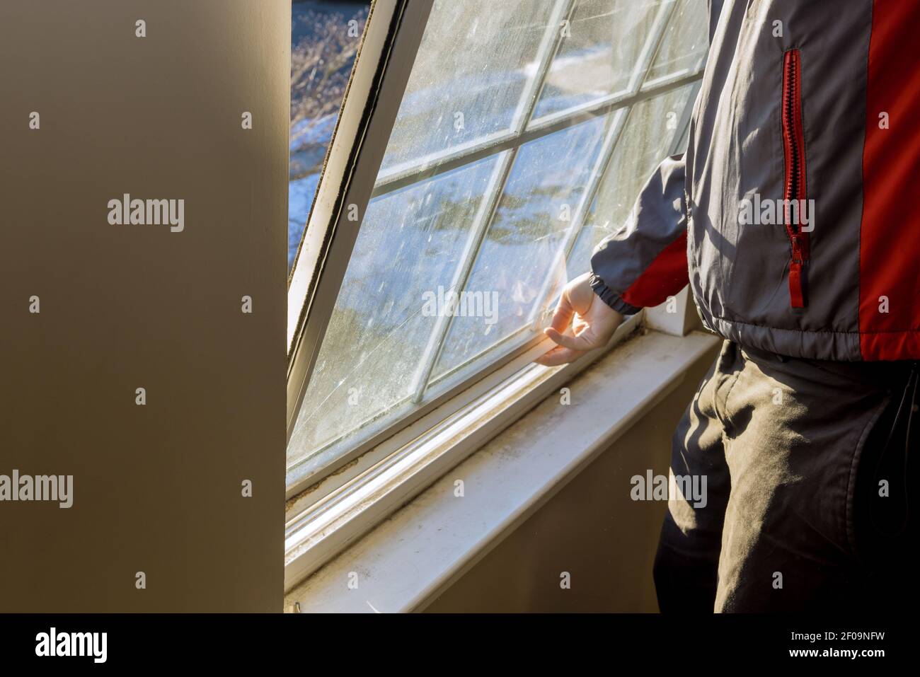 The process of removing an bring downwindow from an opening in a house ... The process of removing an bring downwindow from an opening in a house ...