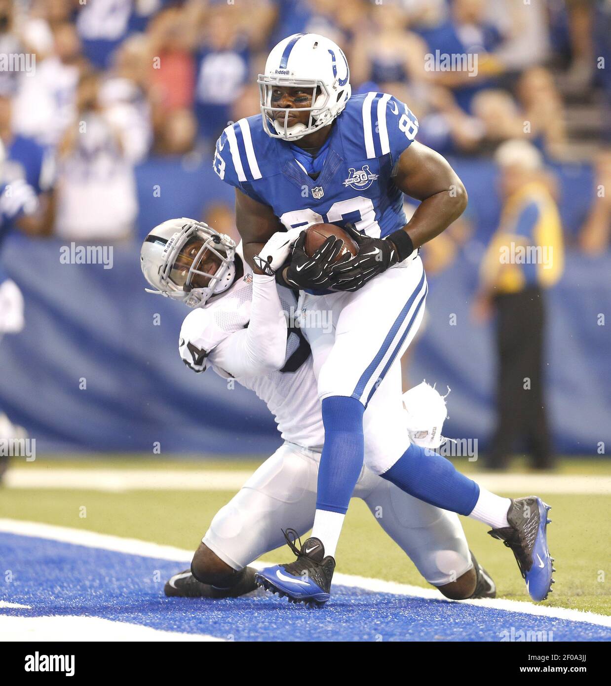 Indianapolis Colts tight end Dwayne Allen (83) drags Oakland Raiders ...