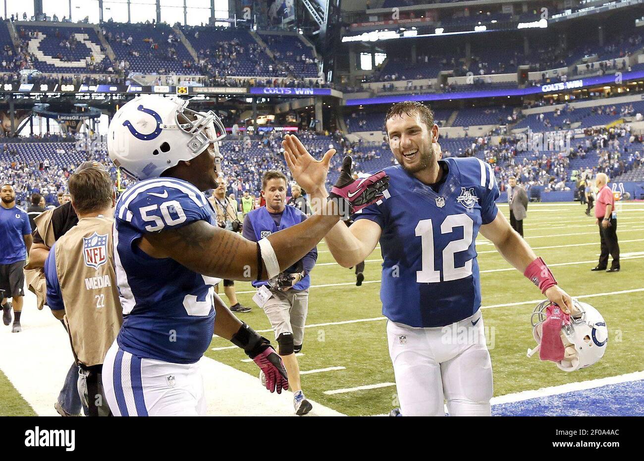 Indianapolis Colts quarterback Andrew Luck (12) high-fives Indianapolis ...