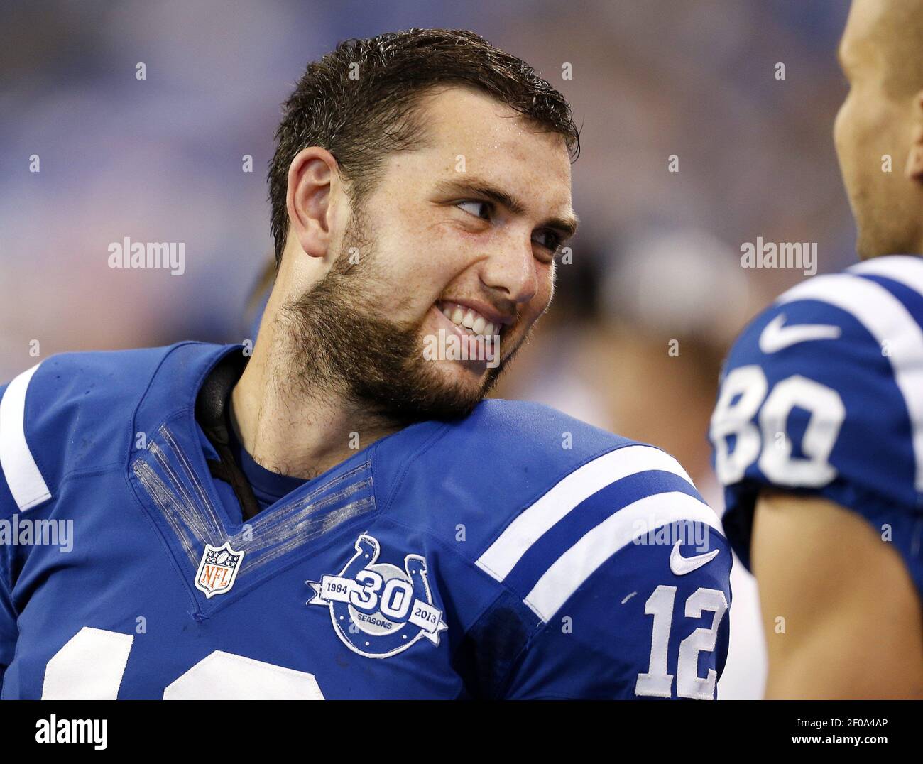 Indianapolis Colts quarterback Andrew Luck (12) talks with teammates on ...