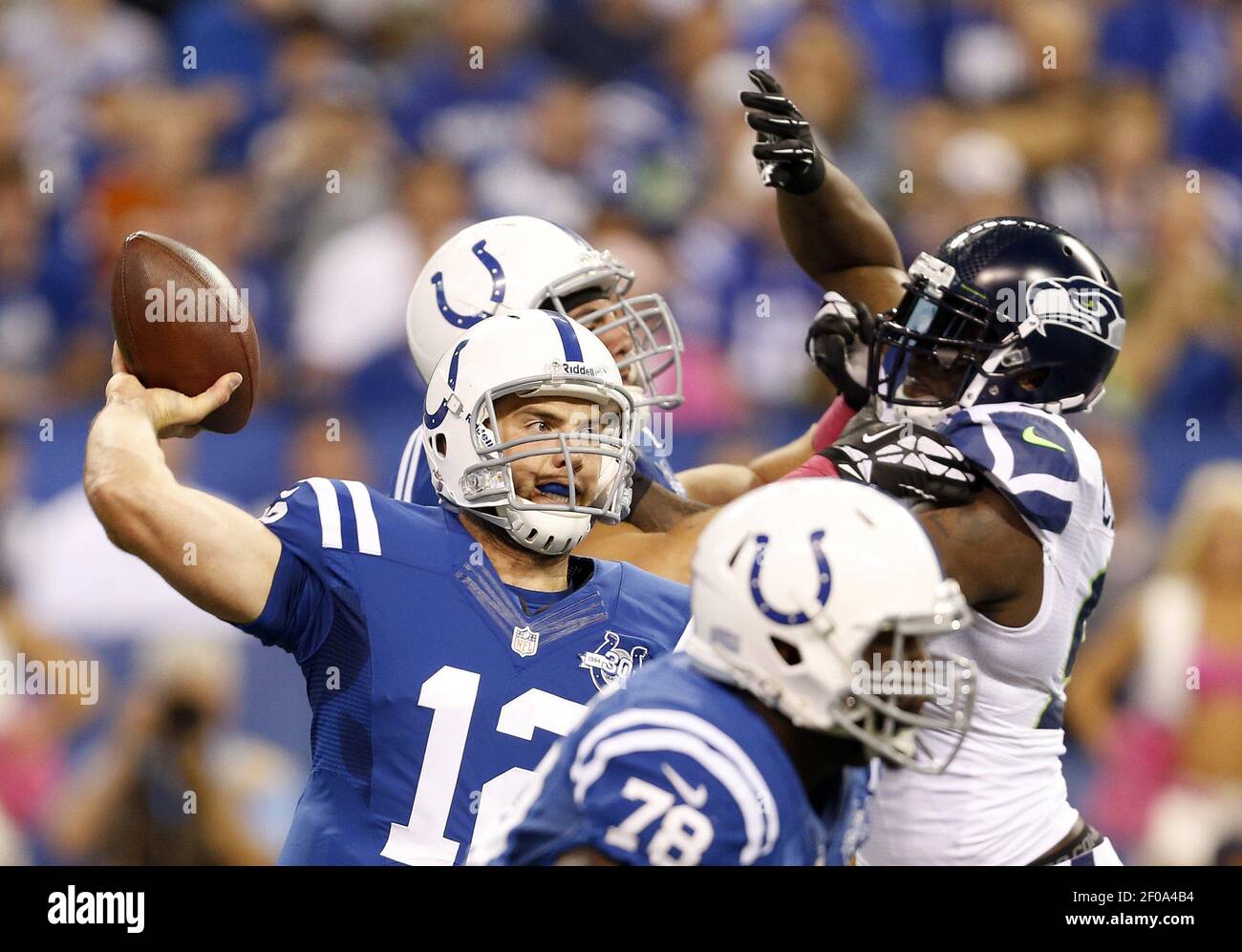 Indianapolis Colts quarterback Andrew Luck (12) throws under pressure ...