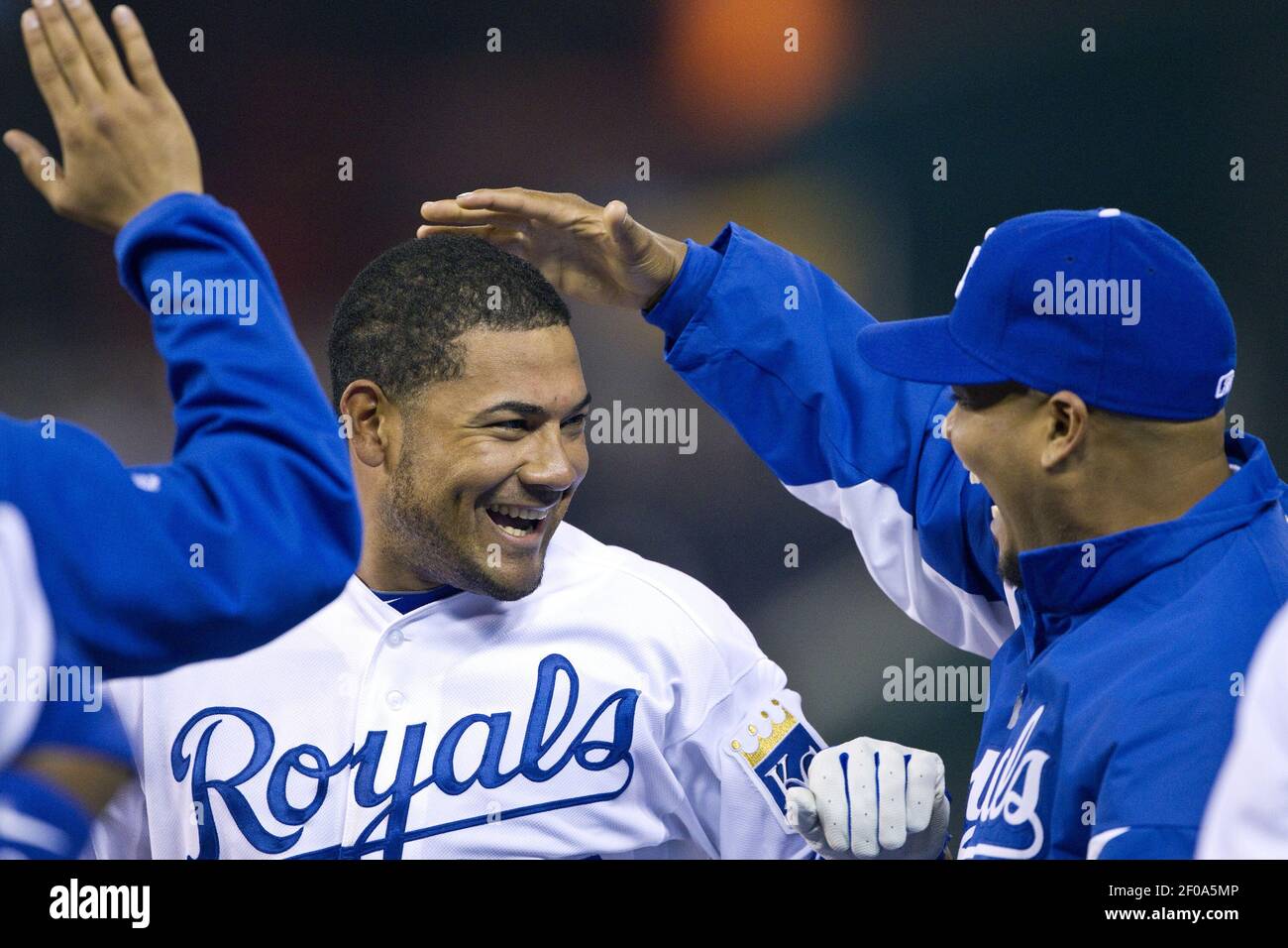 Kansas City Royals' Melky Cabrera (53) gets a pat on the head from ...