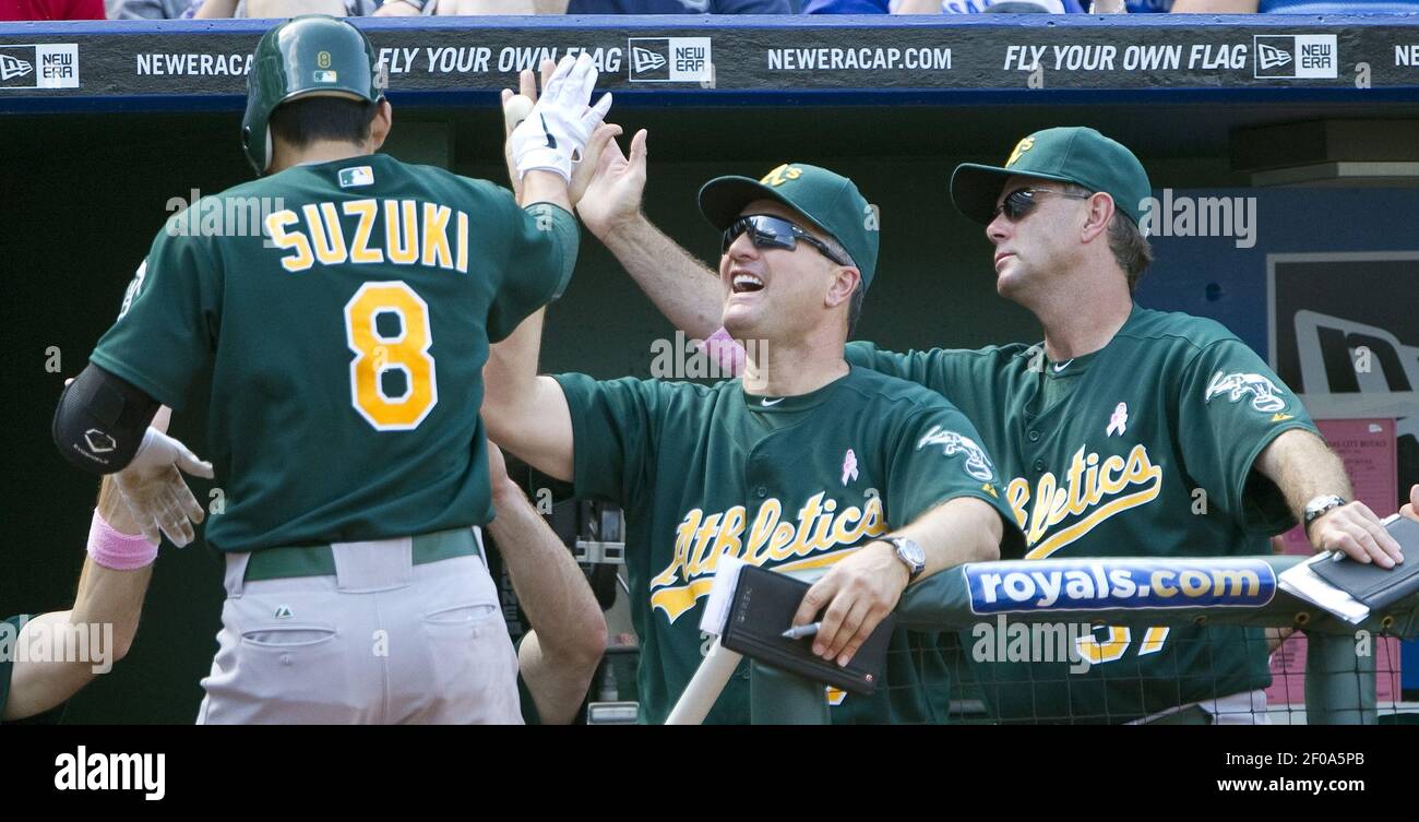Oakland Athletics manager Bob Geren and pitching coach Ron Romanick ...