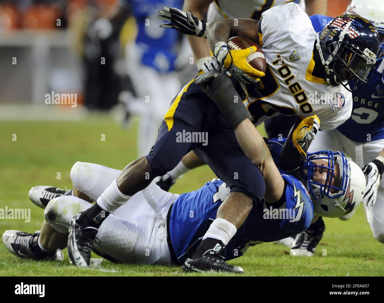 Air Force defensive linebacker Patrick Hennessey tackles Toledo running ...