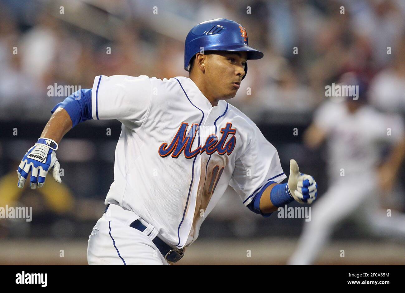 Ruben Tejada of the New York Mets legs out a fourth-inning two-run ...