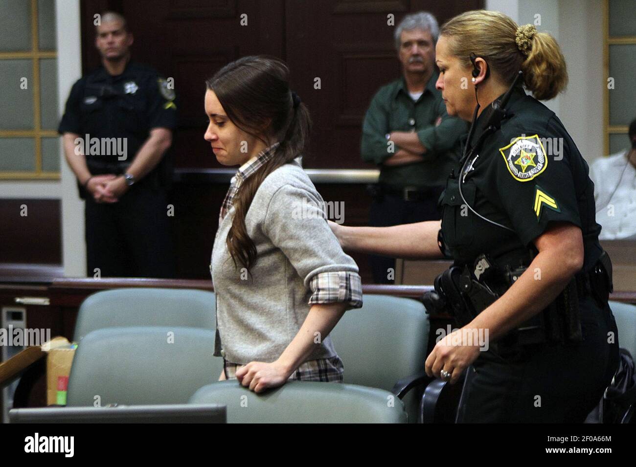 Casey Anthony is escorted Wednesday, April 6, 2011, into a courtroom at ...