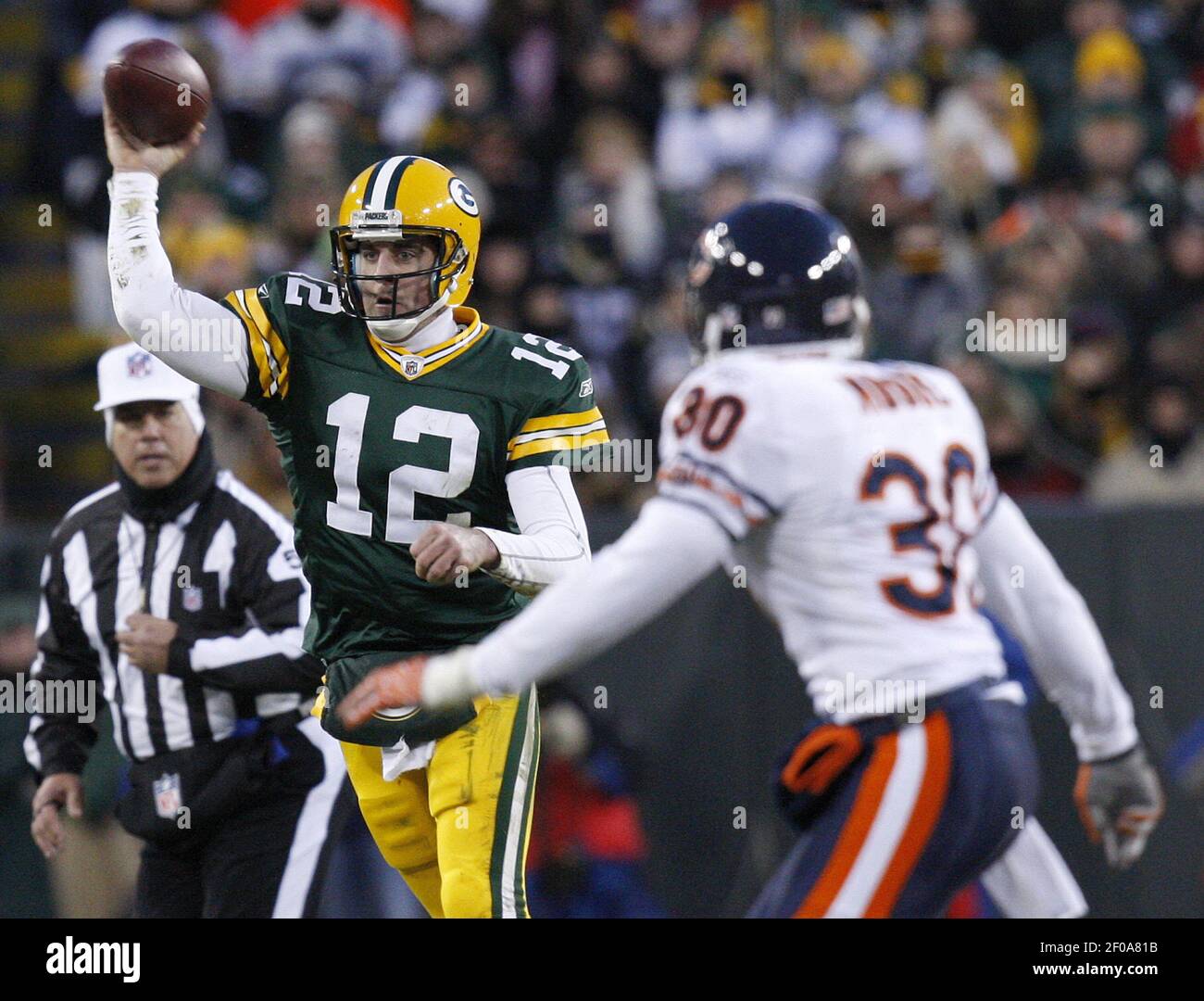 Green Bay Packers' Aaron Rodgers looks to pass against Chicago Bears' D ...