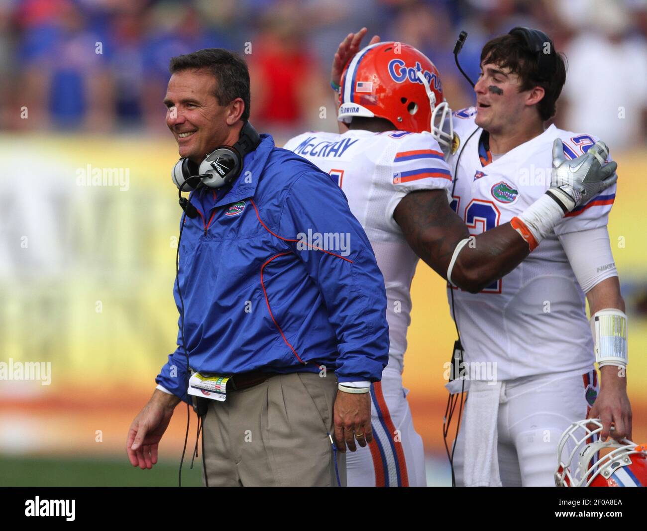 Florida head coach Urban Meyer smiles as John Brantley (12) and ...