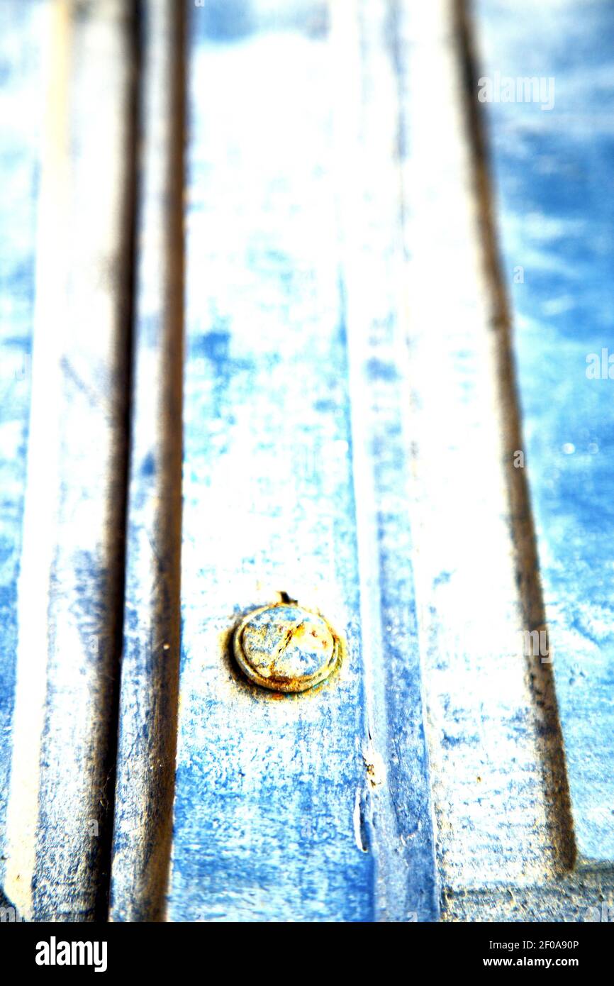 Stripped in wood door and rusty nail Stock Photo - Alamy