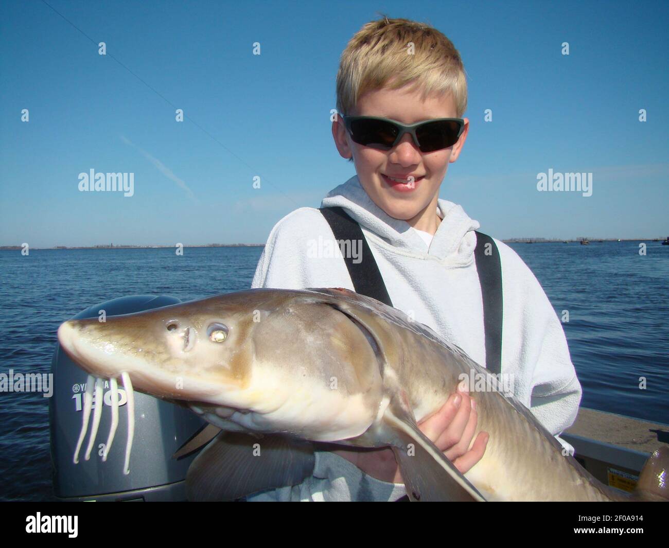 Clay Heppner holds a 41 1/2-inch sturgeon he caught on April 25, 2011 ...